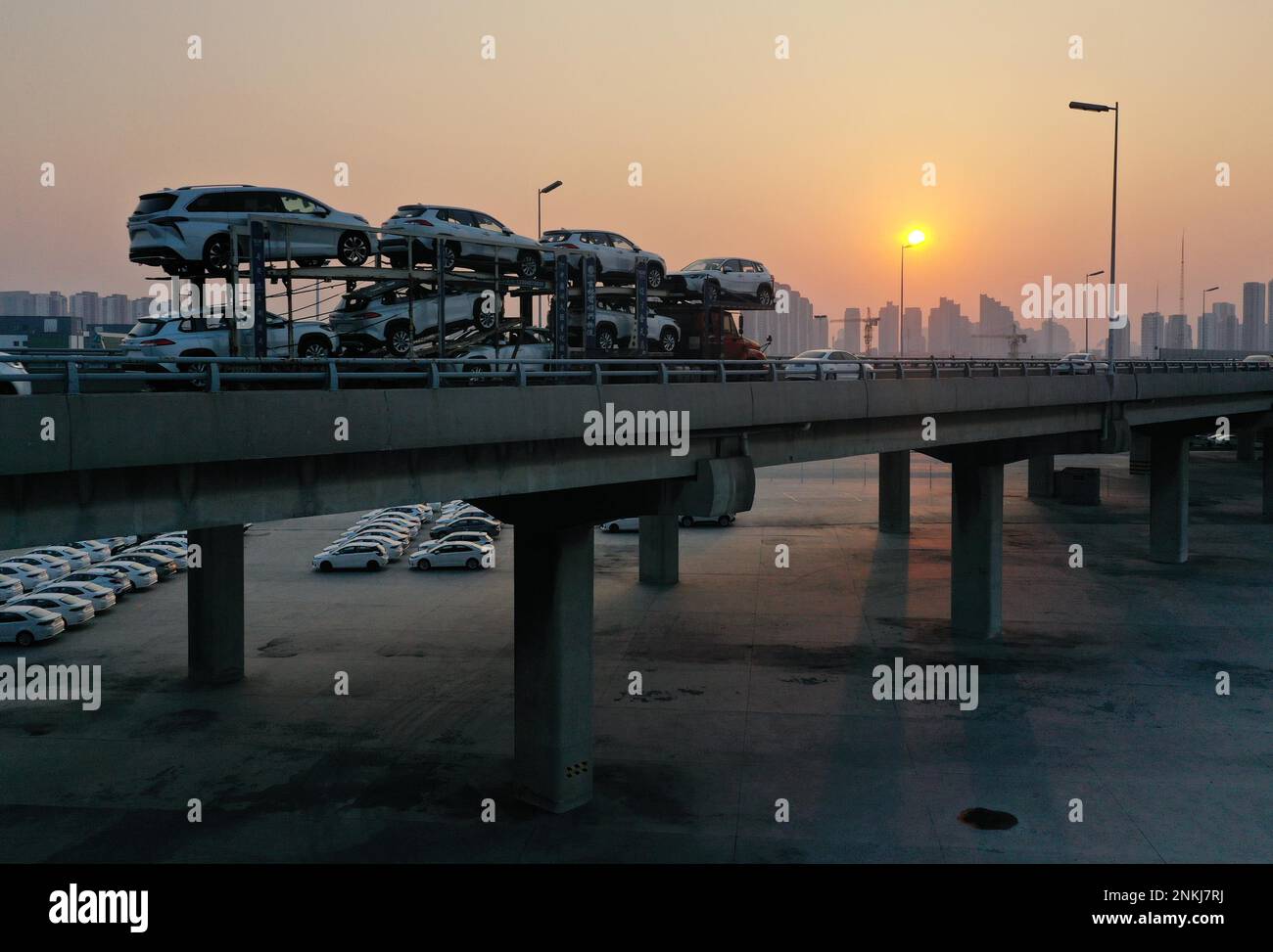 Aerial photo shows all kinds of automobiles parking in a large ...