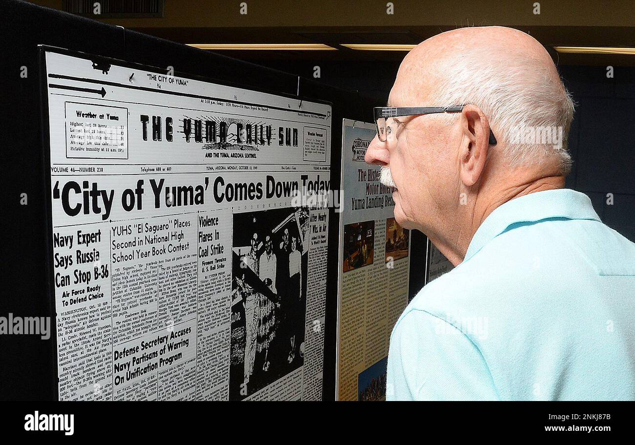 Glen Molenar looks over The Yuma Daily Sun front page from Oct. 10 ...