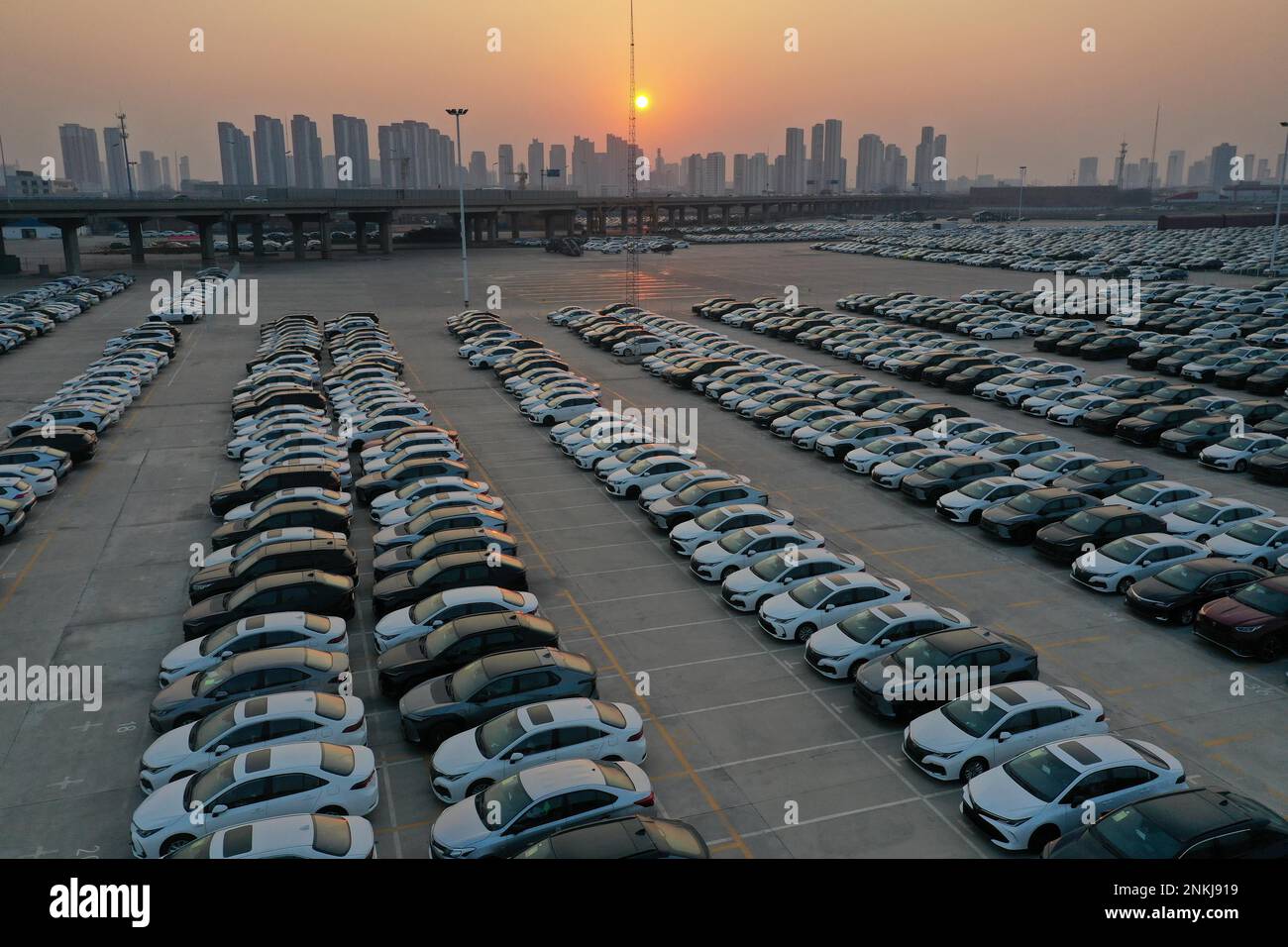 Aerial photo shows all kinds of automobiles parking in a large ...