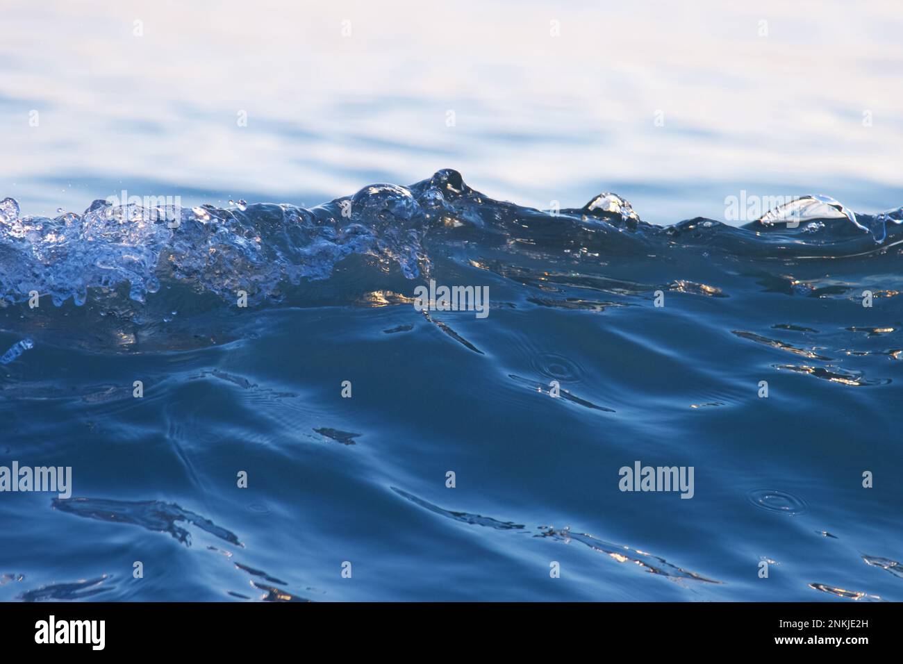 Ocean wave splashing on the beach. Sea wave Stock Photo - Alamy