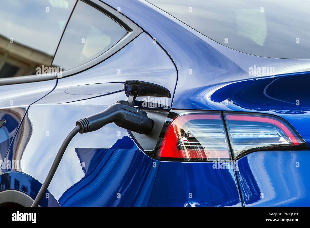 Close-up of charging electric car, clean energy vehicle Stock Photo - Alamy