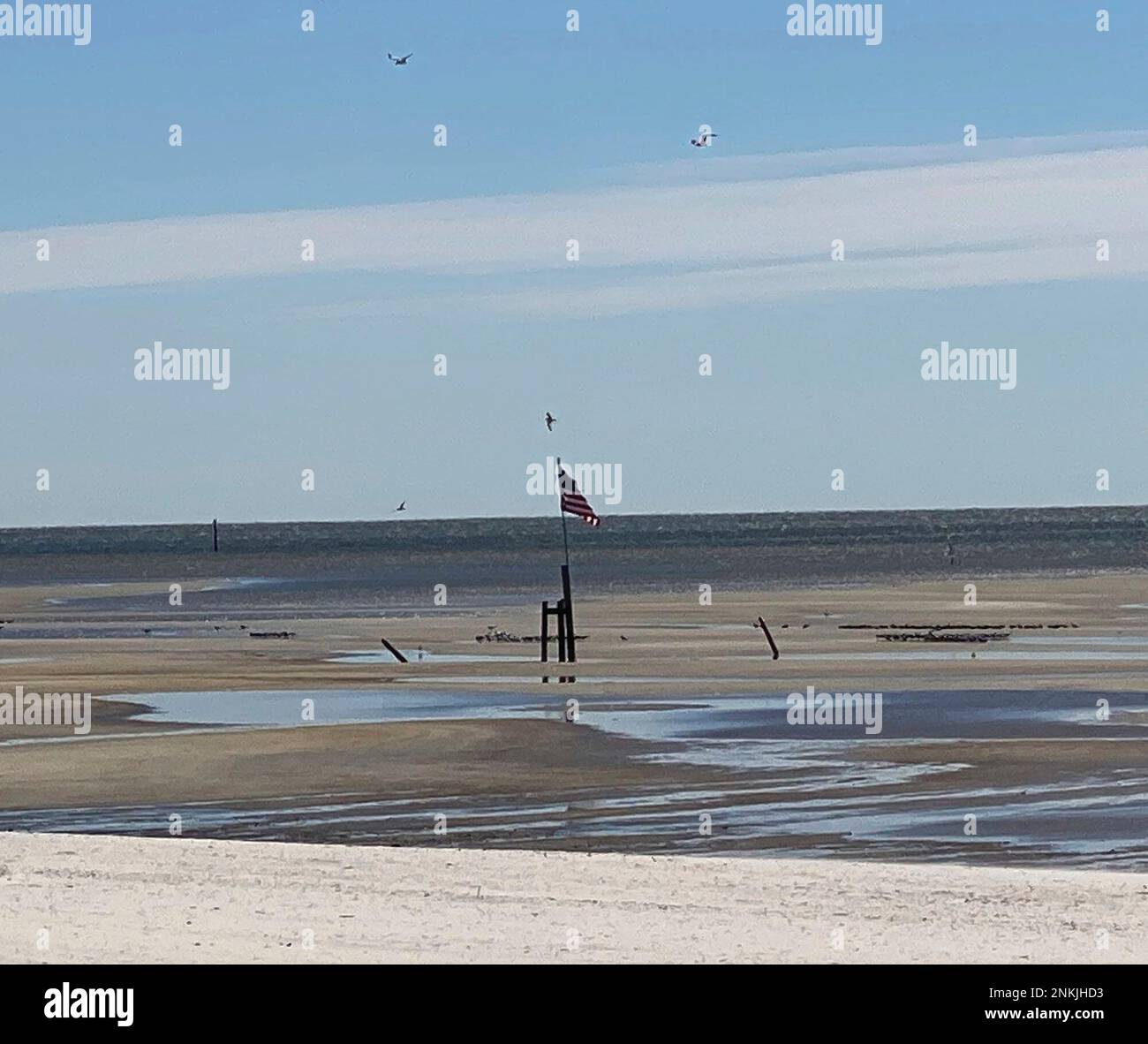 Mississippi Gulf Coast beaches with low tides and an American flag ...