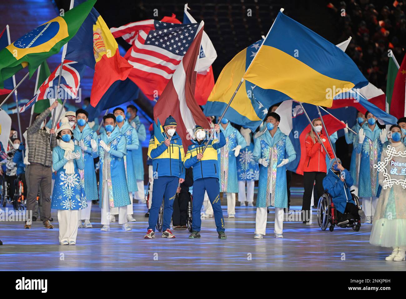 Athletes wave their national flags during the Closing Ceremony of the ...