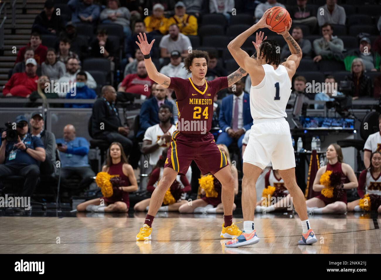 Minnesota guard Sean Sutherlin (24) guards Penn State forward Seth ...