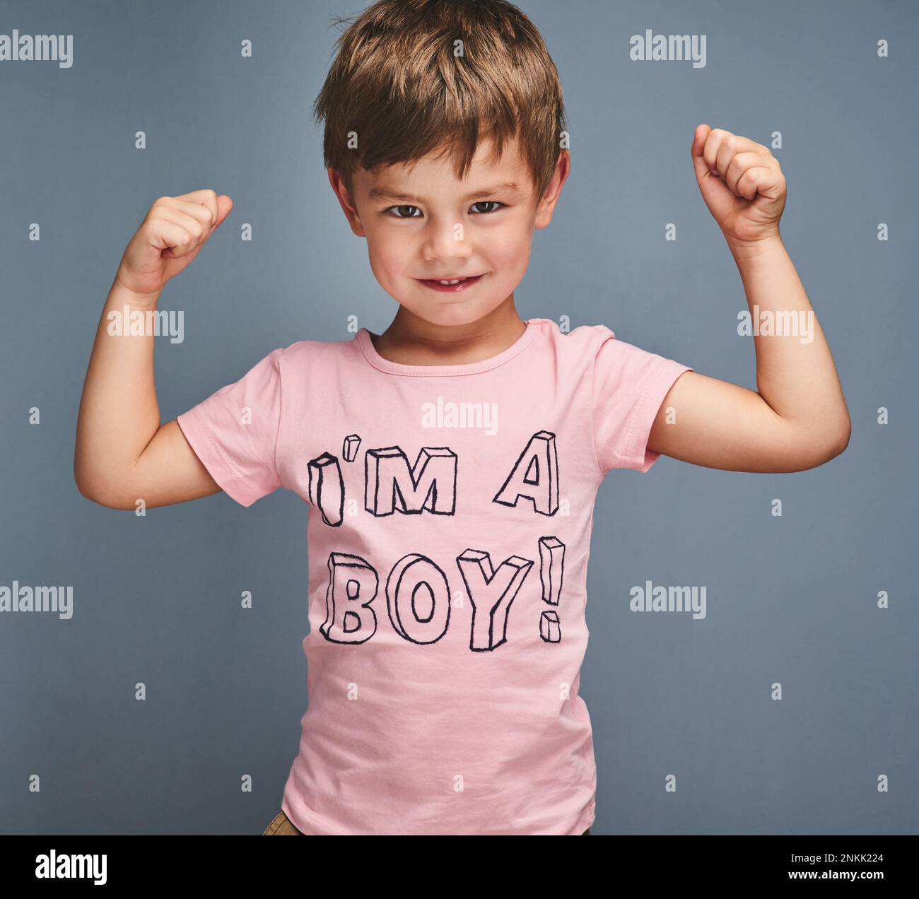 Tough guys wear pink. Studio portrait of a cheering boy wearing a shirt ...