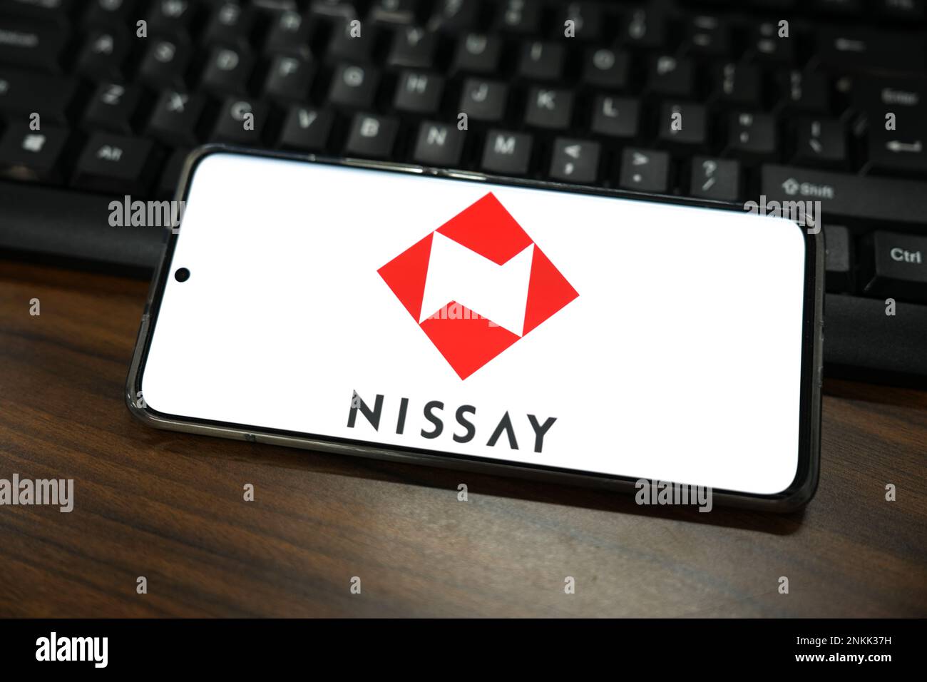 In this photo illustration, a Nissay logo is displayed on the screen of ...