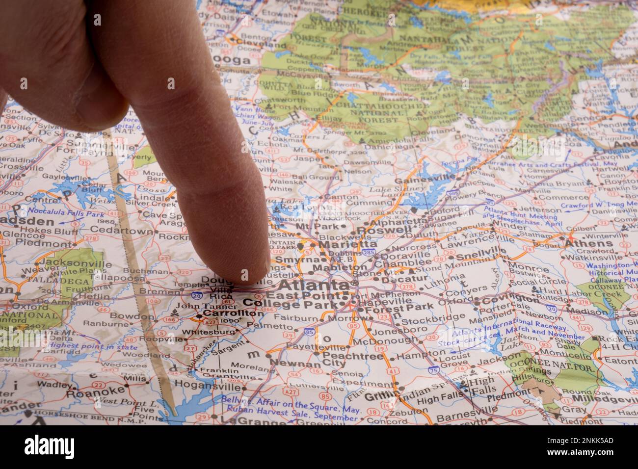 Close up of finger pointing to Atlanta, Georgia on detailed colorful ...