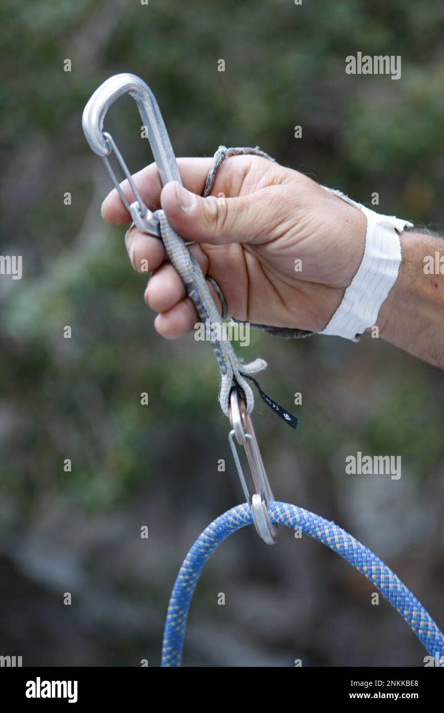 A quick draw is used by rock climbers to connect various types of ...