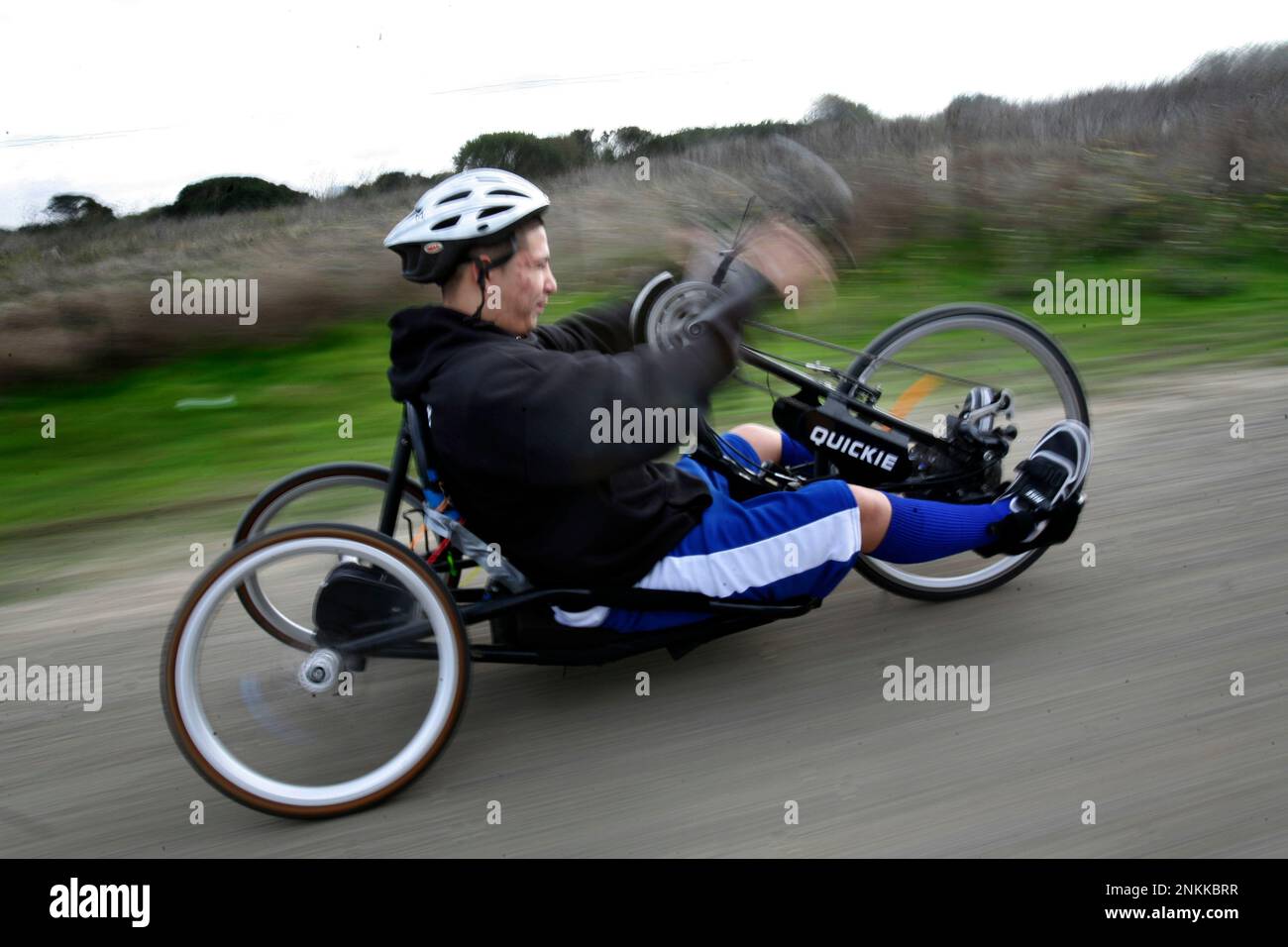 Arthur Renowitzky's arms are a blur as cranks his three-wheeled bike ...