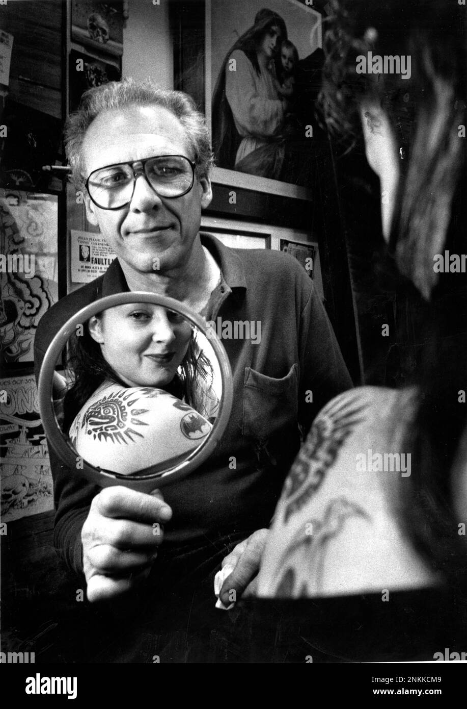 Lyle Tuttle shows 'Bella' her touched-up tattoo. (Michael Maloney/San ...