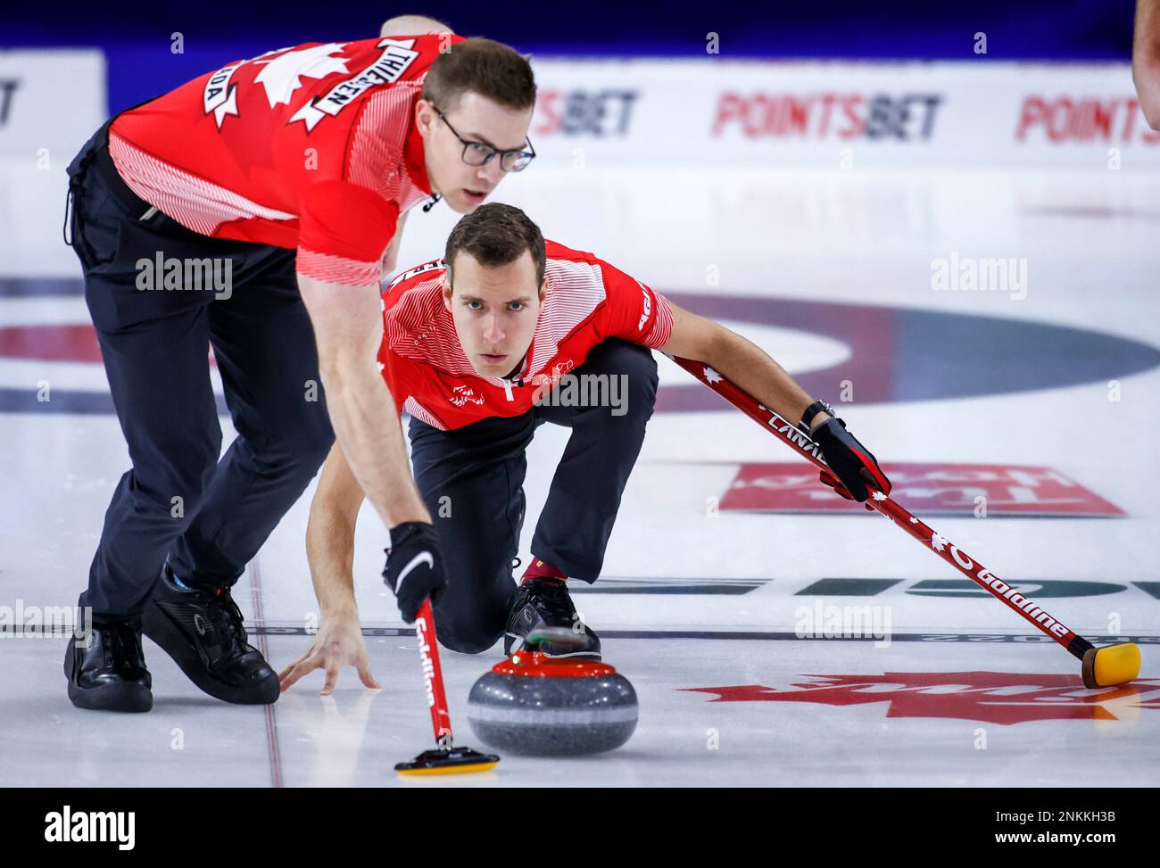 Team Canada skip Brendan Bottcher, right, makes a shot as second Brad ...