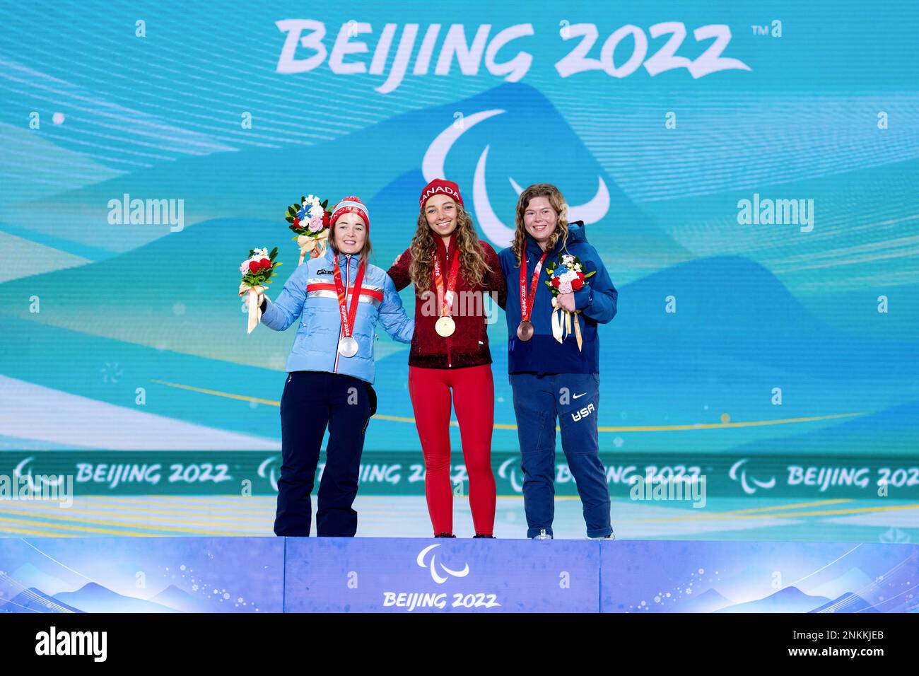 Gold medalist Natalie Wilkie, of Canada, center, poses with Silver ...