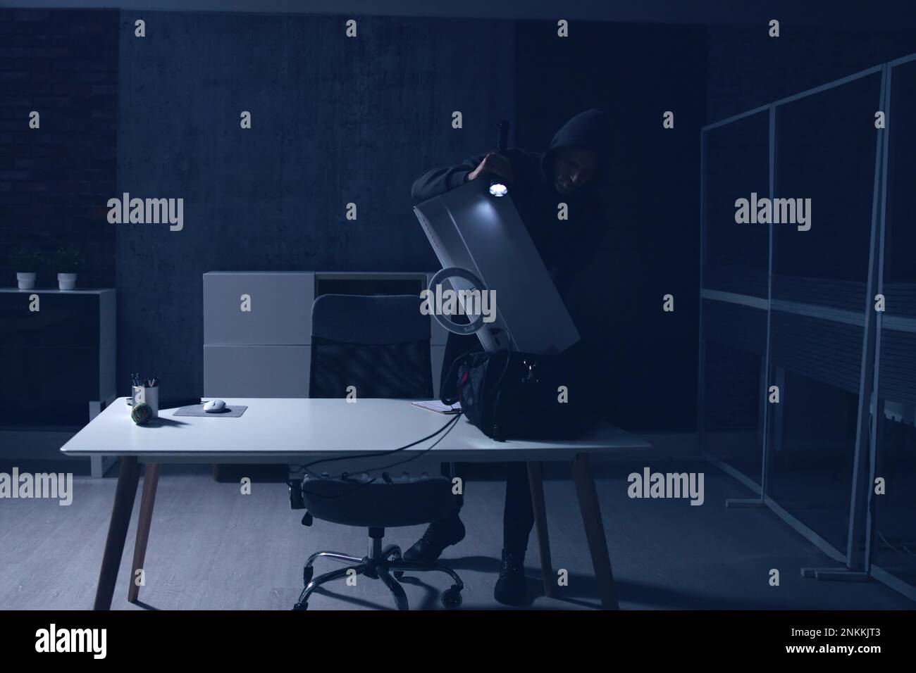 Thief Stealing Computer From Office At Night Stock Photo - Alamy