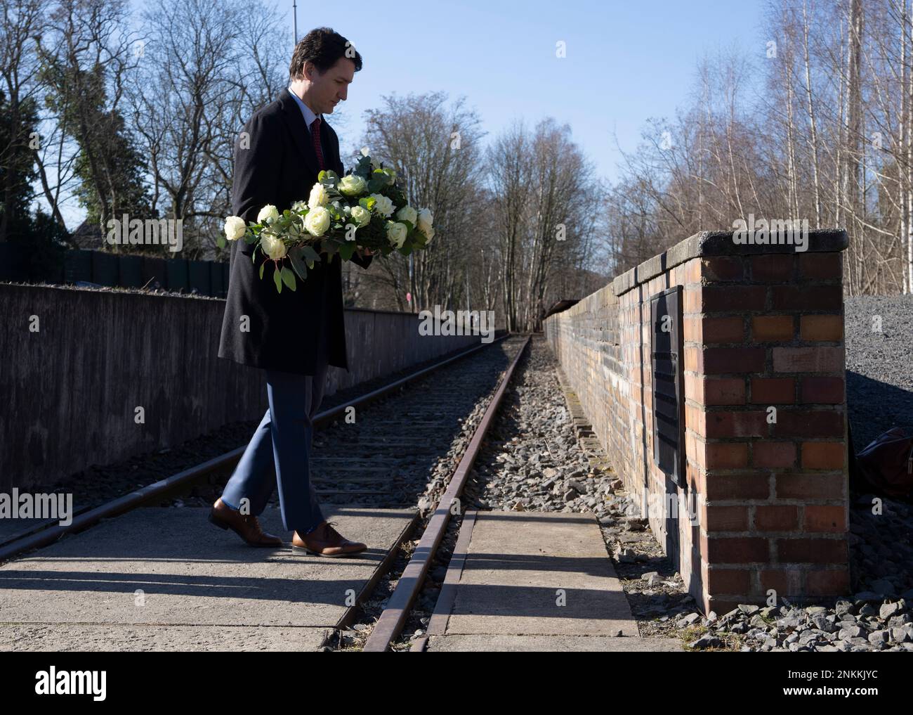 Canadian Prime Minister Justin Trudeau lays flowers at the Platform 17 ...
