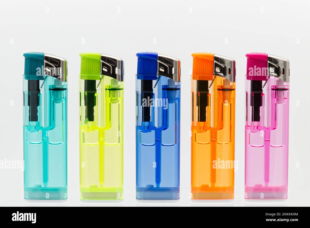 Set of transparent lighters in a row isolated on white background Stock ...