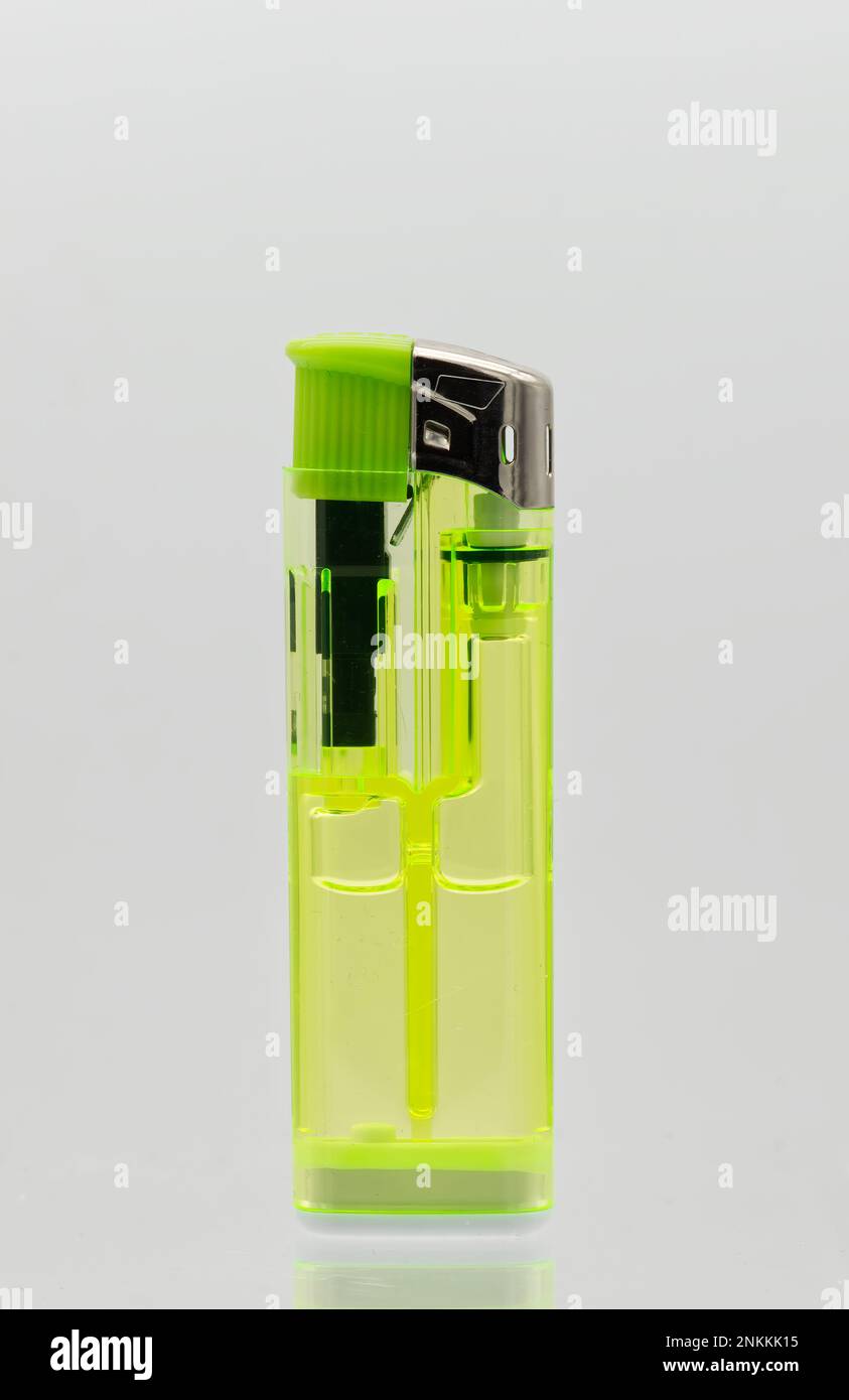 Yellow transparent lighter isolated on white background Stock Photo - Alamy