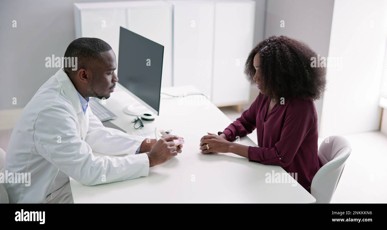 Gynecologist Consulting Woman On Diaphragm Contraception And Birth ...