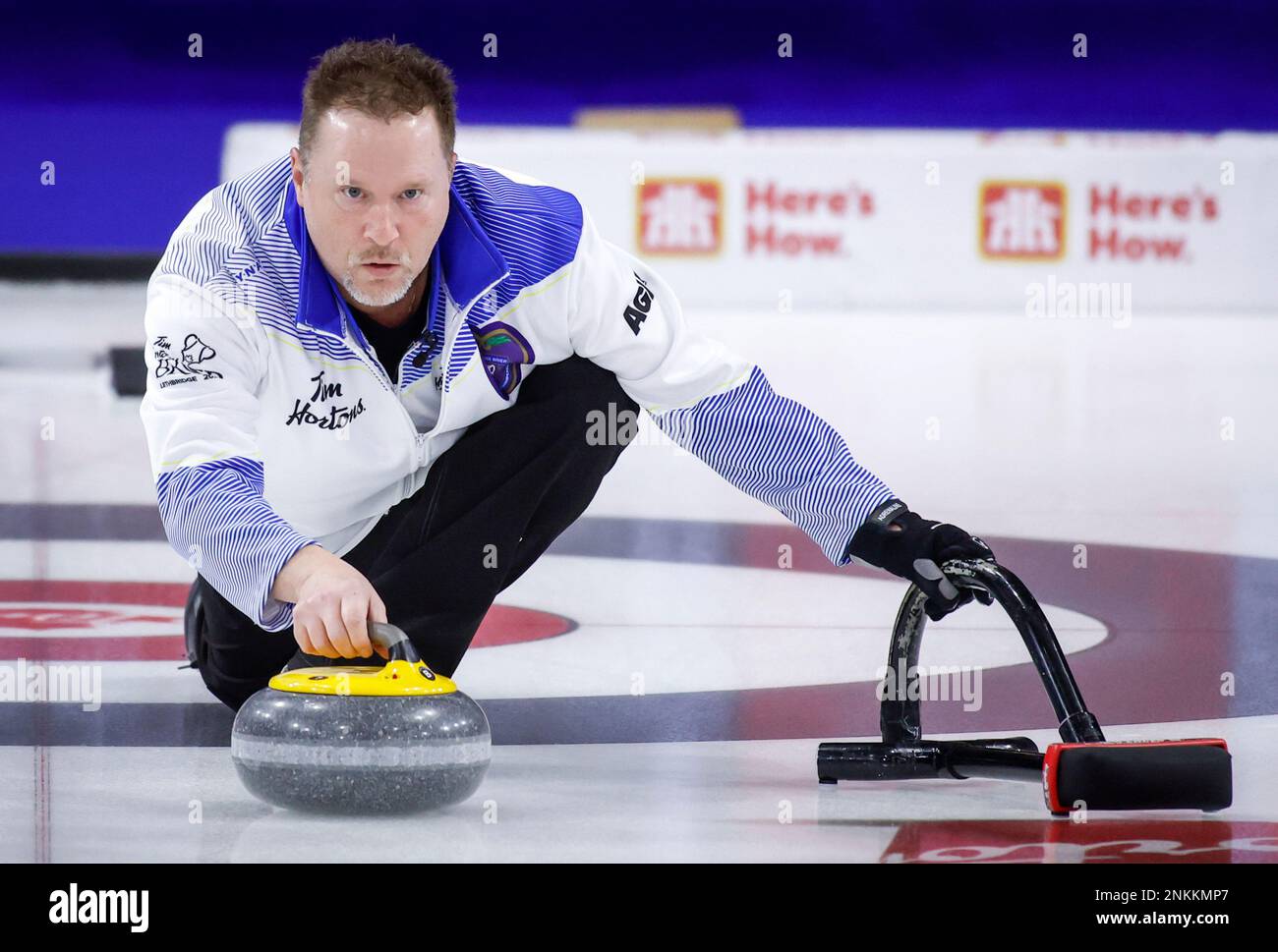 Team British Columbia skip Brent Pierce makes a shot while playing Team ...