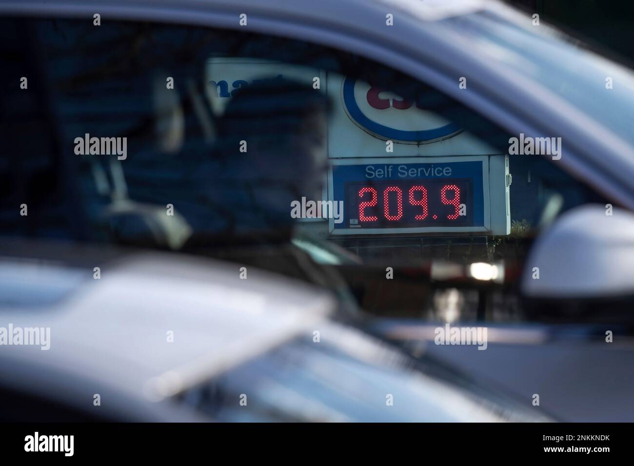A sign displays the price of a litre of regular grade gasoline at an ...