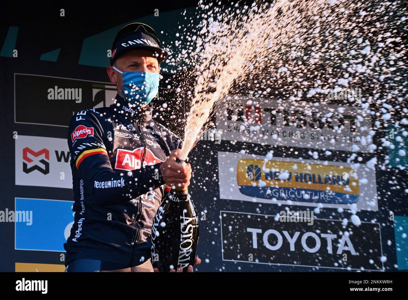 Belgium's Tim Merlier celebrates on podium after winning the second ...