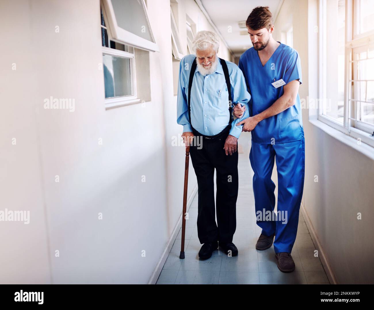 The road to recovery begins now. a young doctor helping his senior ...
