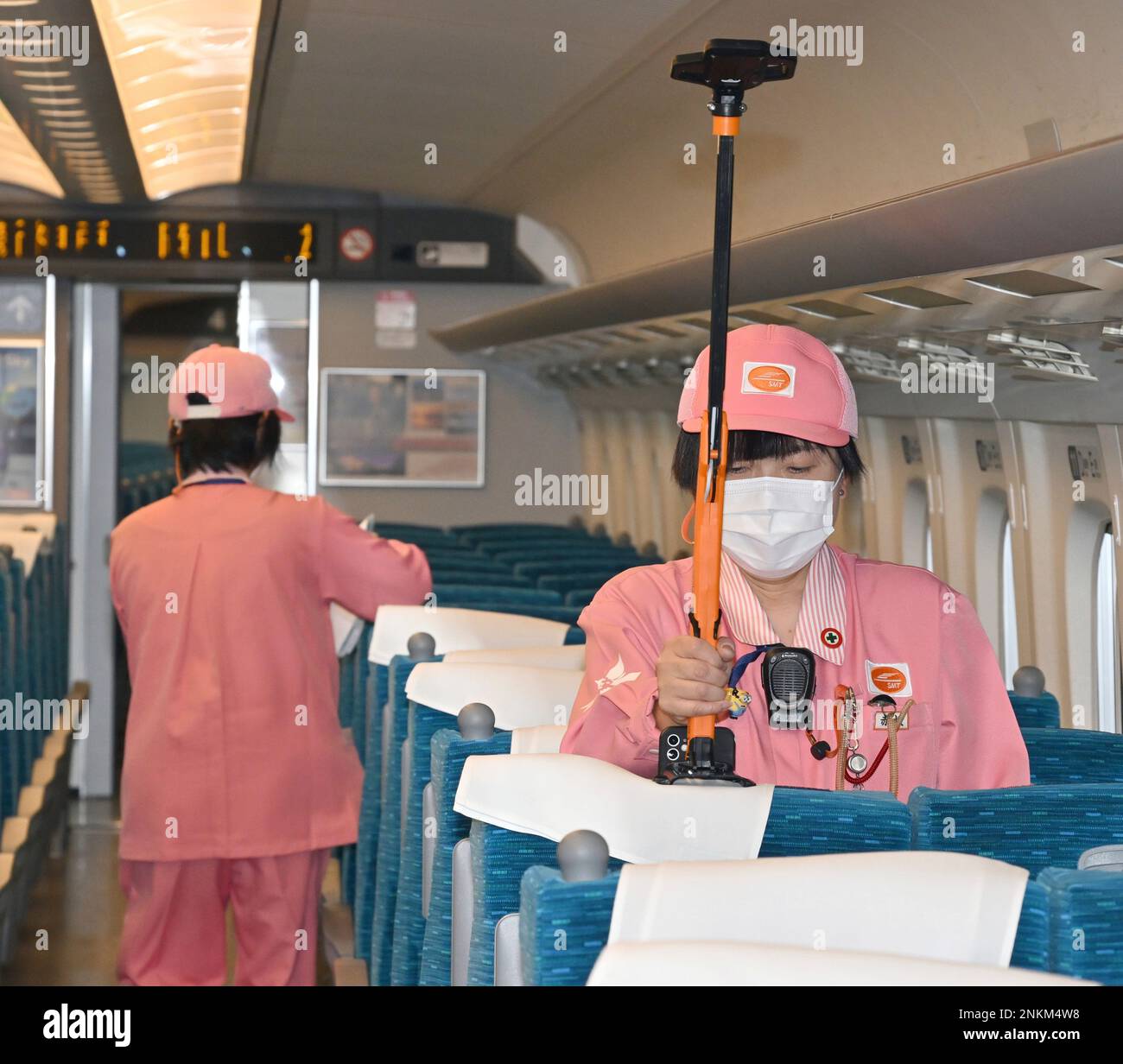 The staffs clean the Shinkansen (Bullet train) during stopping at Tokyo ...