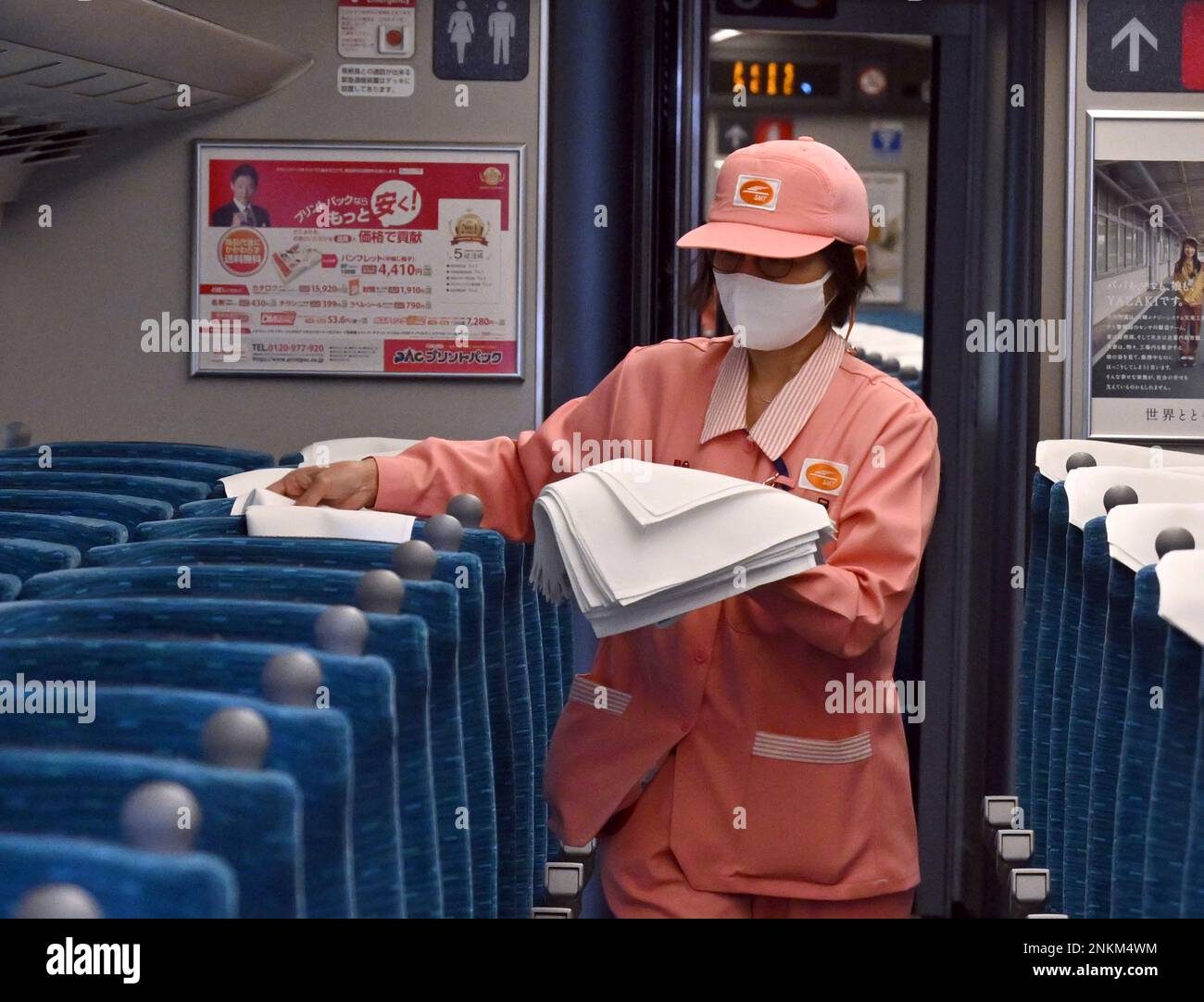The staffs clean the Shinkansen (Bullet train) during stopping at Tokyo ...