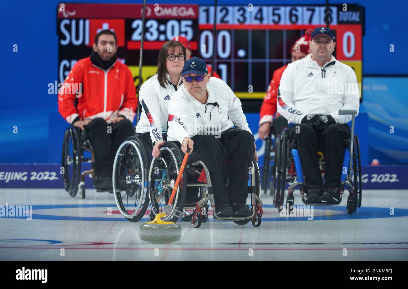 Gregor Ewan of Great Britain releases a stone in the Wheelchair Curling ...