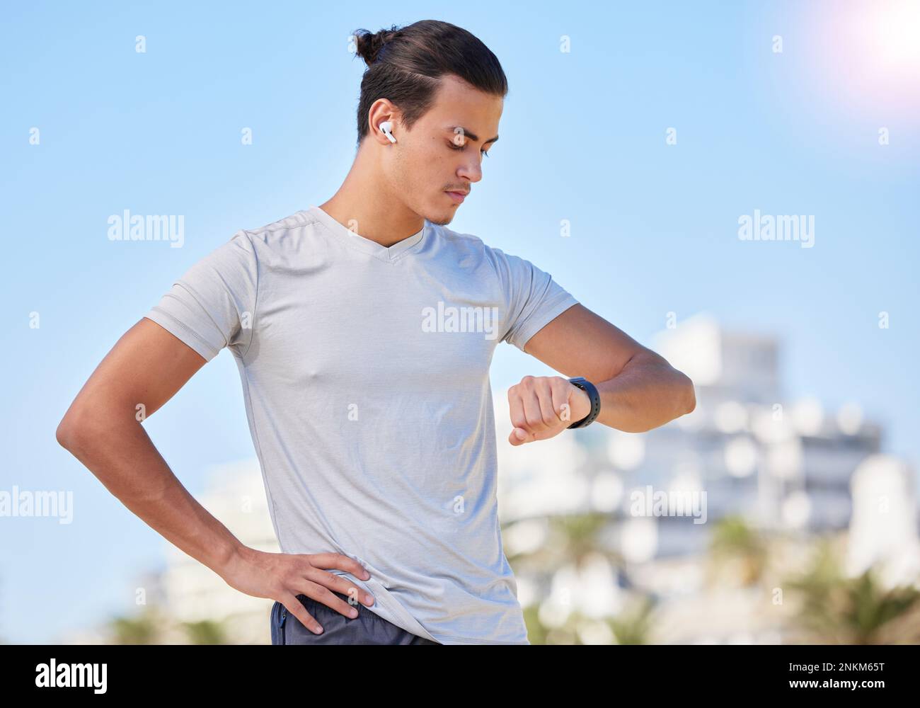 Exercise, smartwatch and man checking running, health and cardio ...