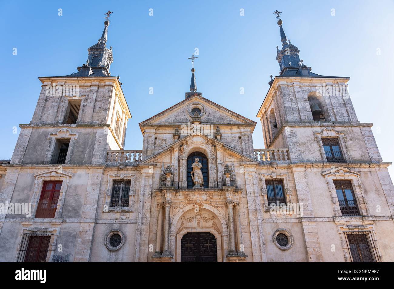 Church towers and monumental palace in the tourist town of Nuevo Baztan ...