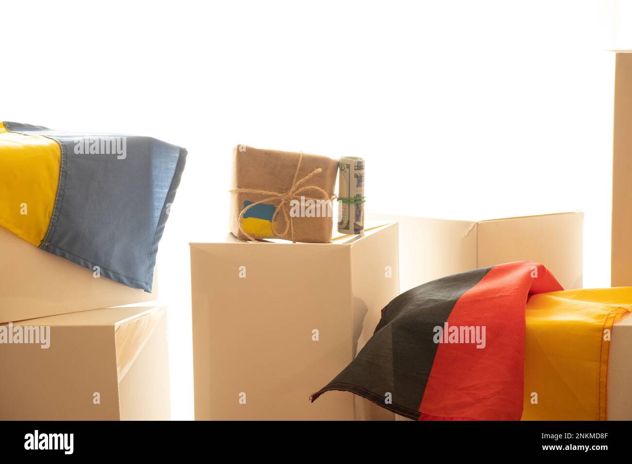 Boxes with humanitarian aid for Ukraine and the flag of Germany and ...