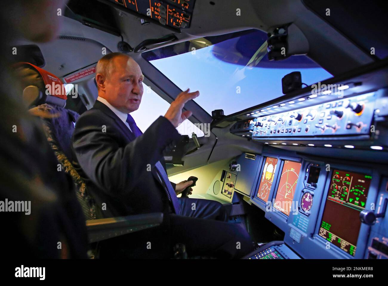 Russian President Vladimir Putin sits in the cockpit of an airplane ...