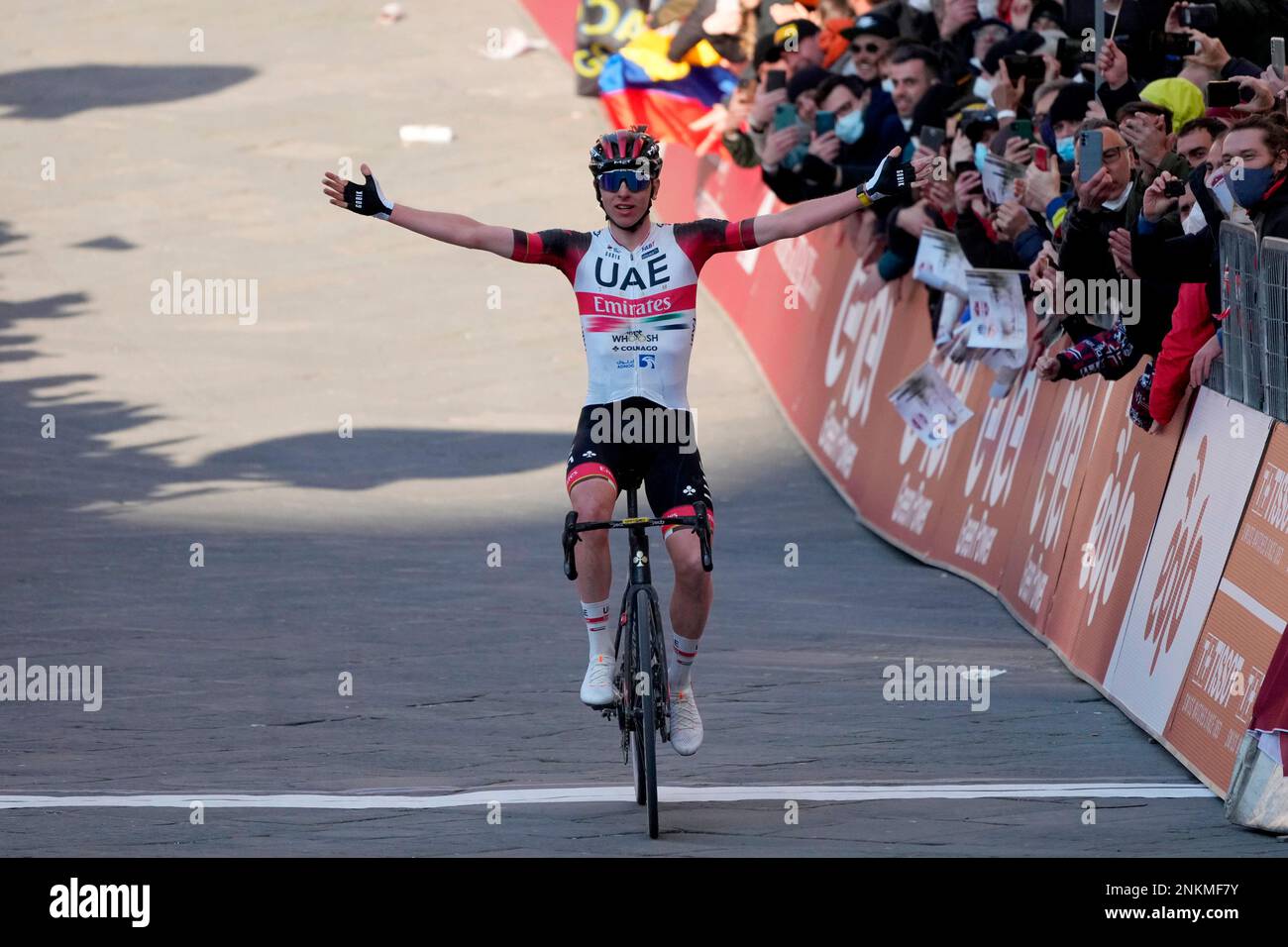 Slovenia's Tadej Pogacar crosses the finish line to win the Strade ...