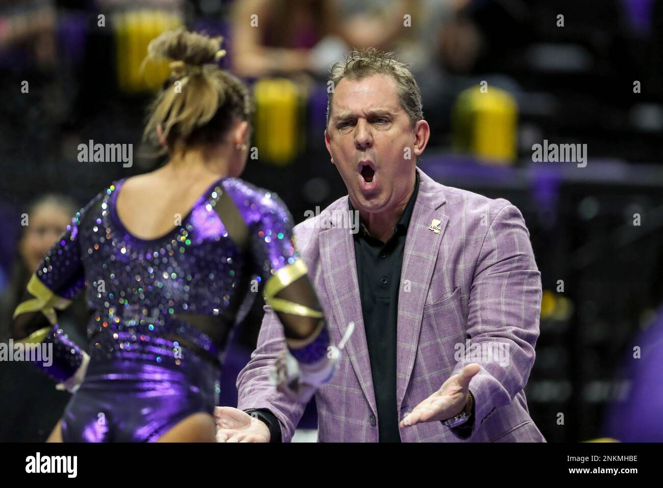 March 4, 2022: LSU Head Coach Jay Clark celebrates a good uneven bar ...