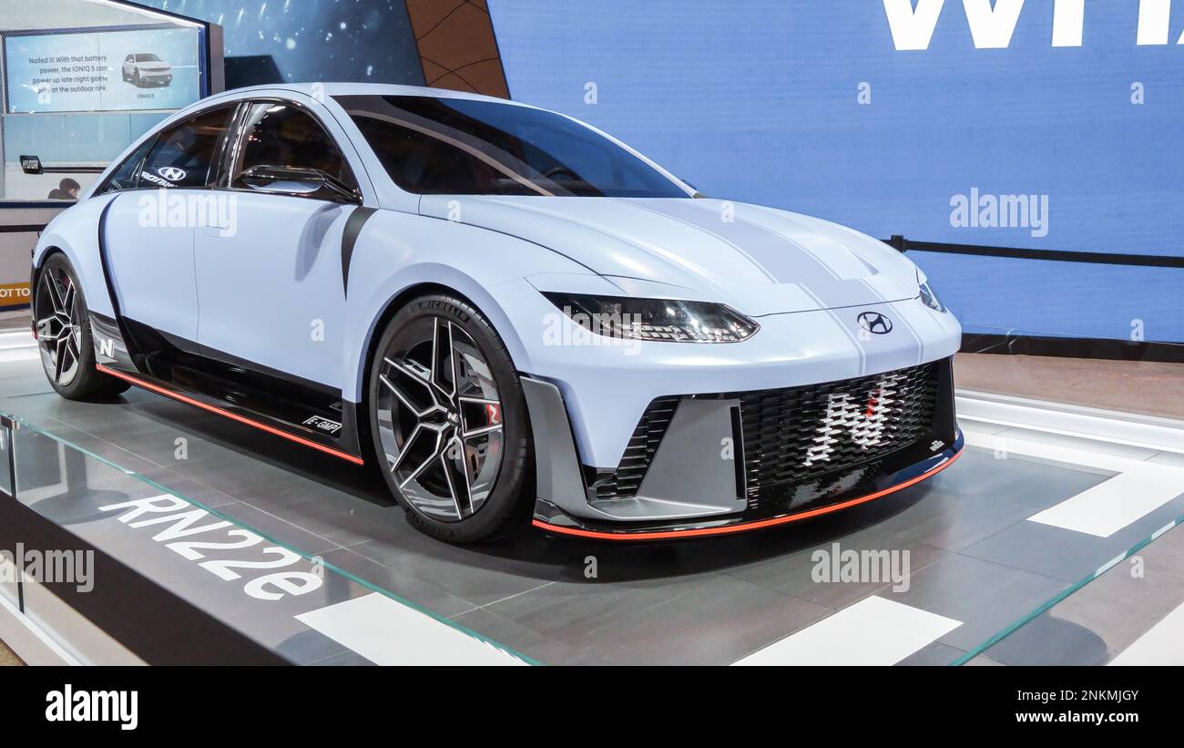 Crowds looking at new car models at Auto show. Hyundai RN22e electric ...