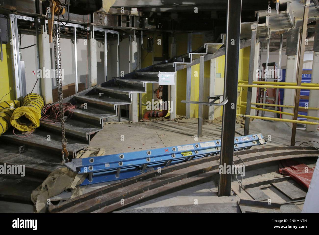 A large spiral staircase is being built through the observation deck ...