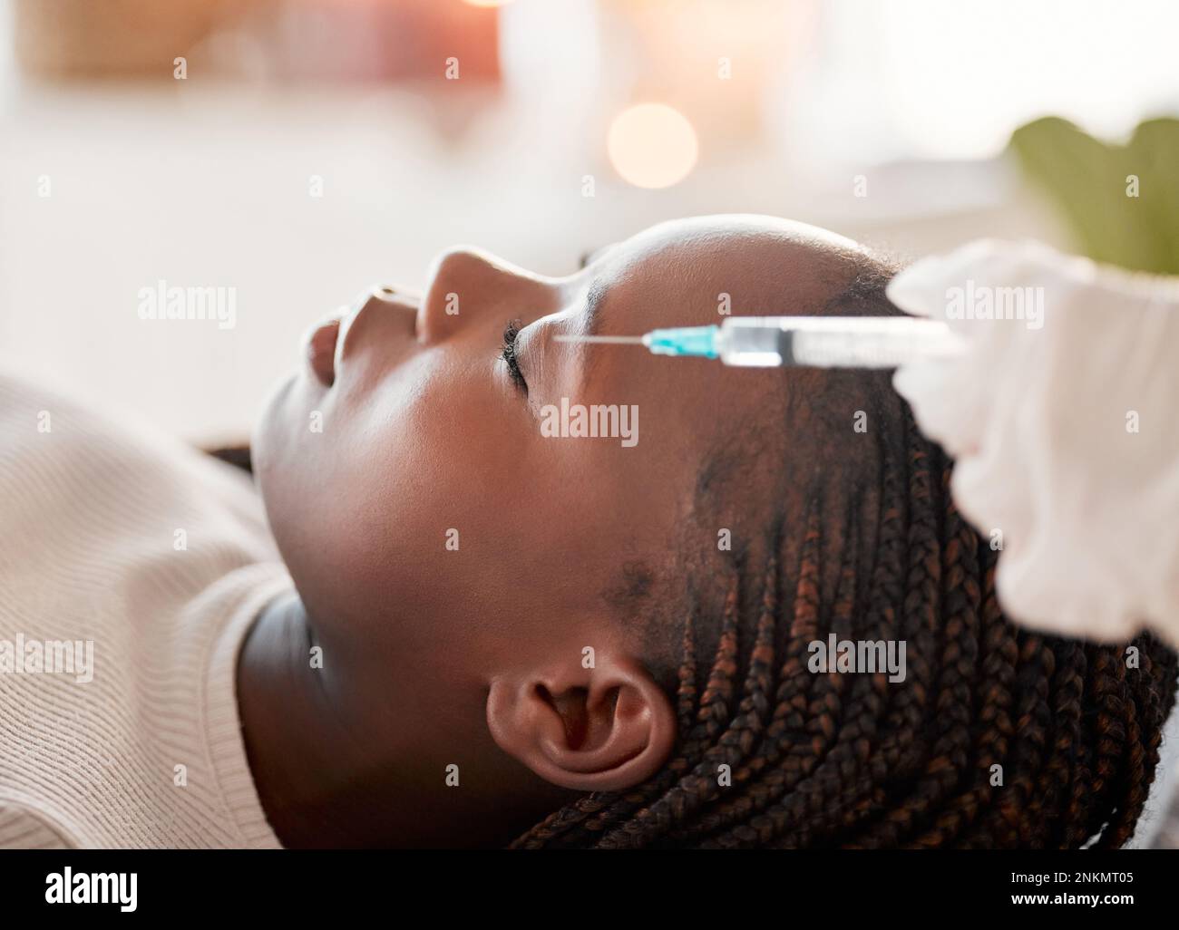Face, needle and collagen, black woman at spa with injection for ...