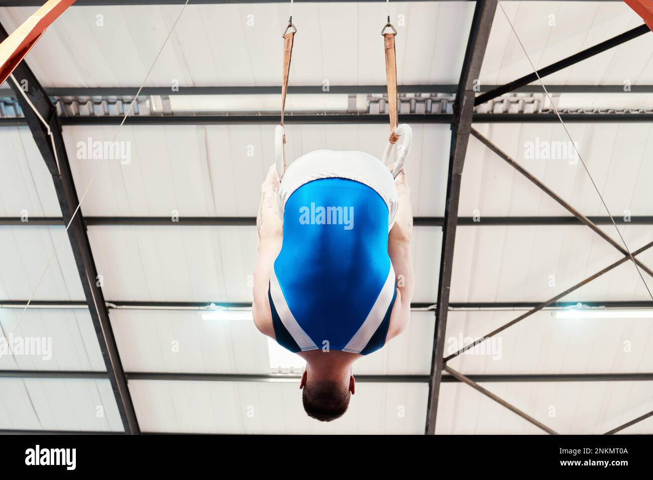 Man, acrobat and gymnastics on rings in fitness for practice, training ...
