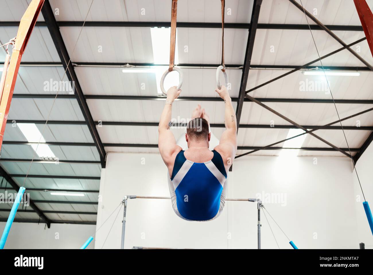 Young man swinging on gym hi-res stock photography and images - Alamy