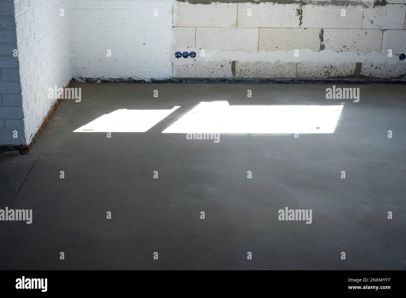 The leveled rough floor in a house under construction with a semi-dry ...