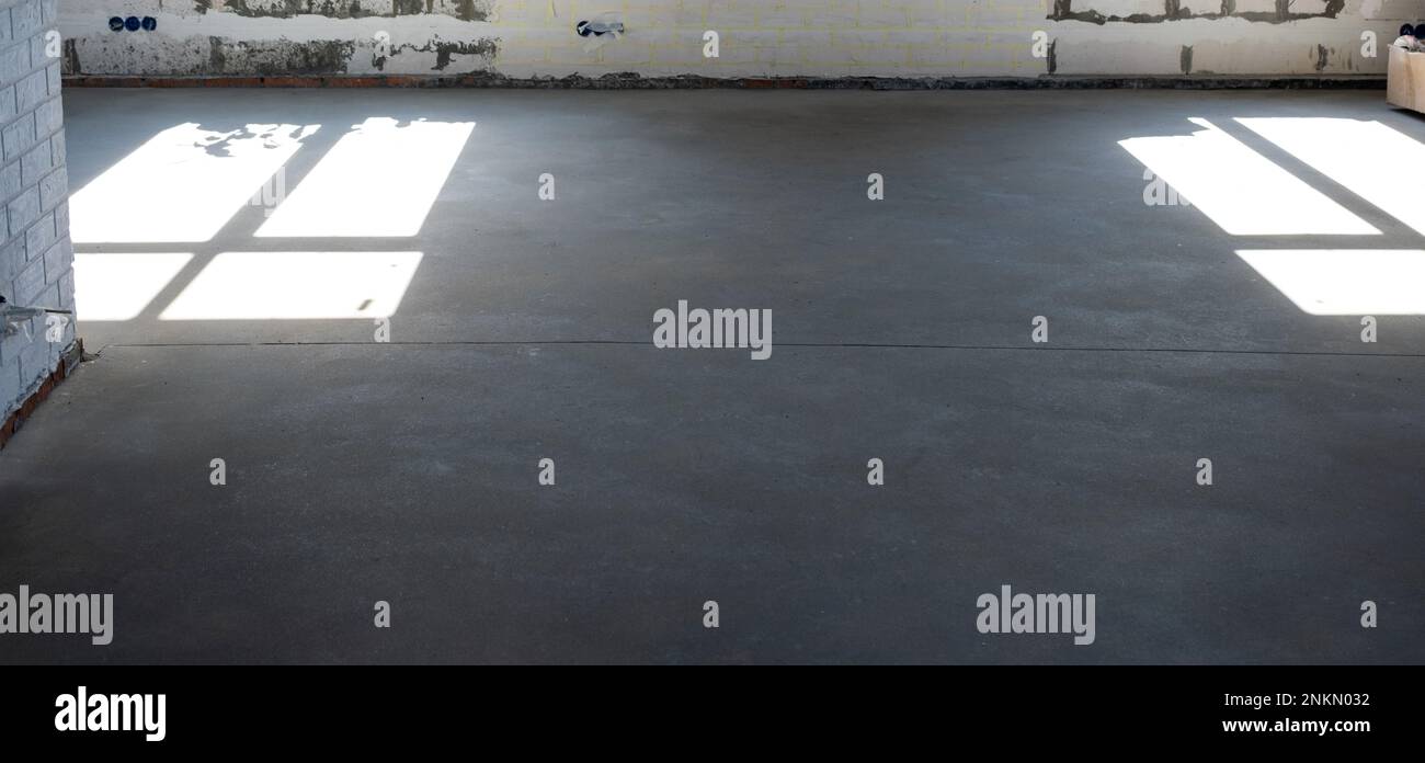 The leveled rough floor in a house under construction with a semi-dry ...