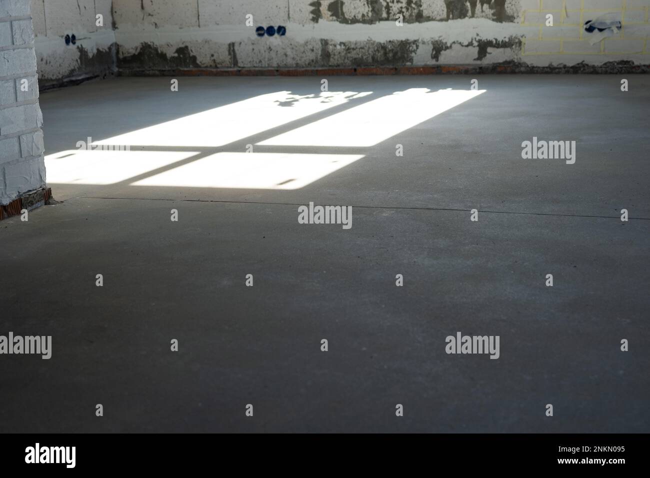 The leveled rough floor in a house under construction with a semi-dry ...
