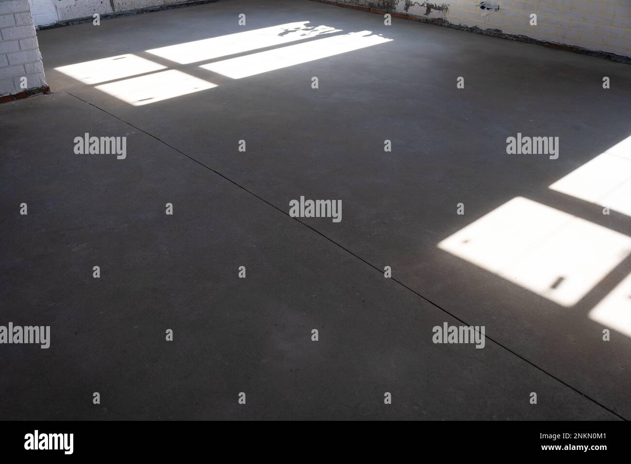 The leveled rough floor in a house under construction with a semi-dry ...