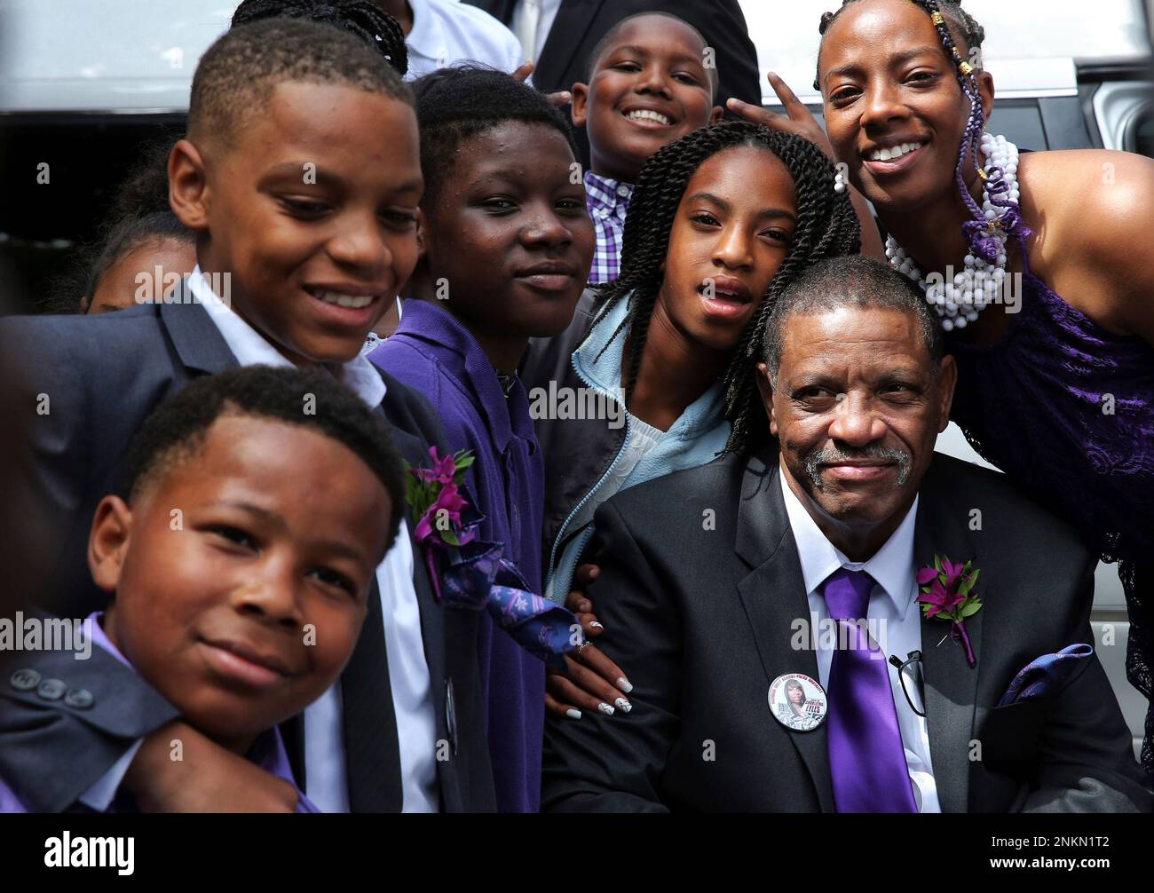 Charles Lyles Jr., lower right, poses for a photo with his ...