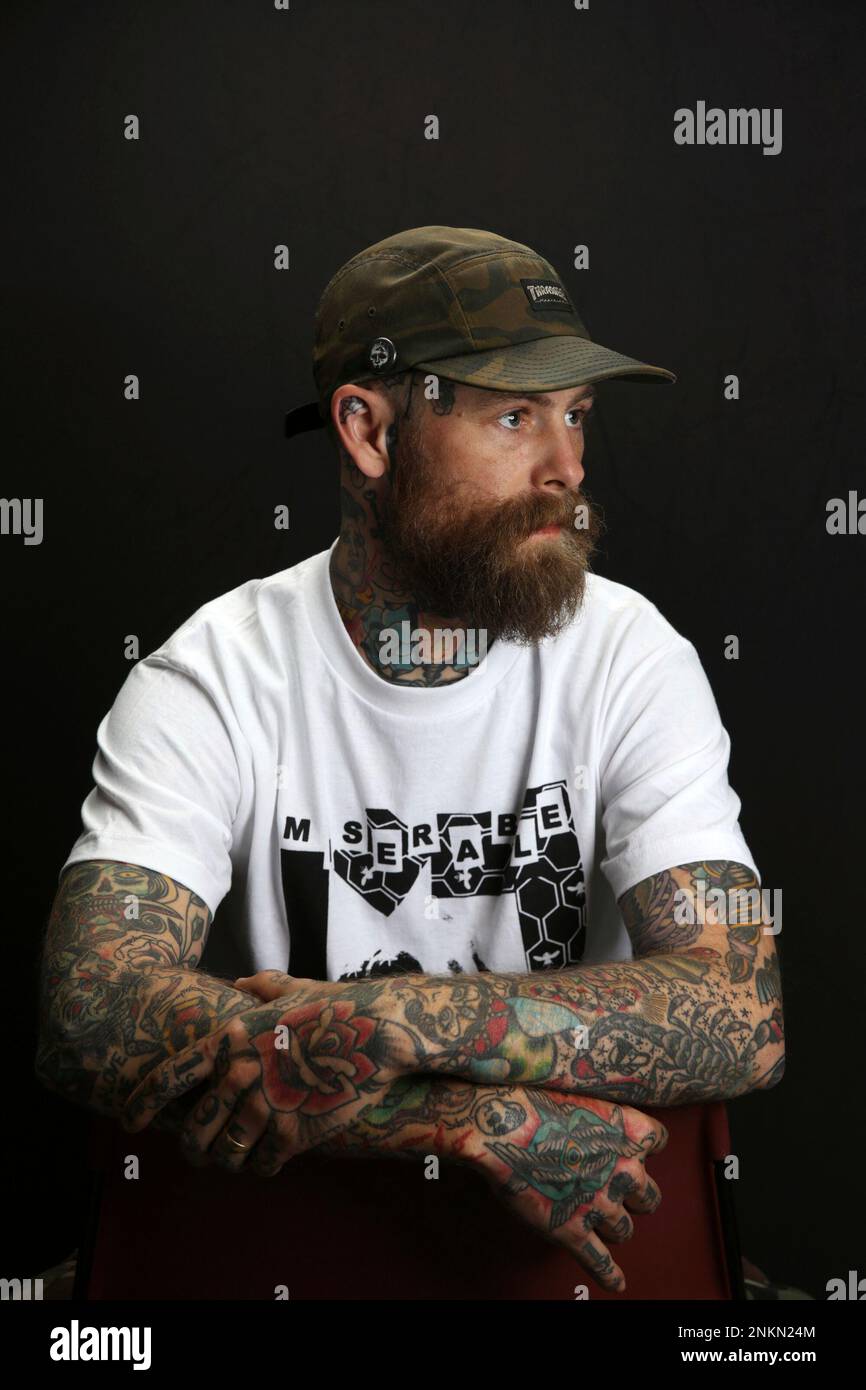 Jeff McKay, manager at Dark Age Tattoo, poses for a portrait at the ...