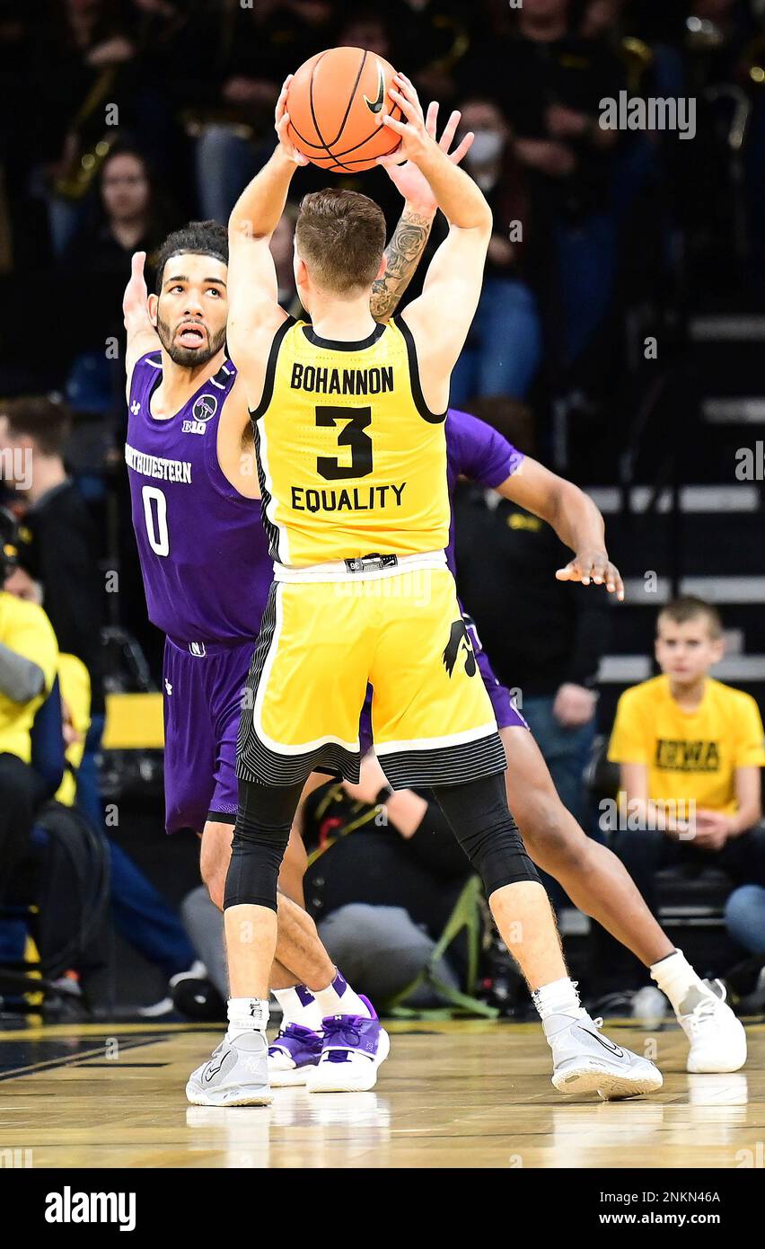 IOWA CITY, IA - FEBRUARY 28: Northwestern guard Boo Buie (0) reaches ...