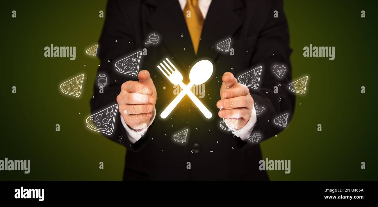 Hand holding food related icons Stock Photo - Alamy