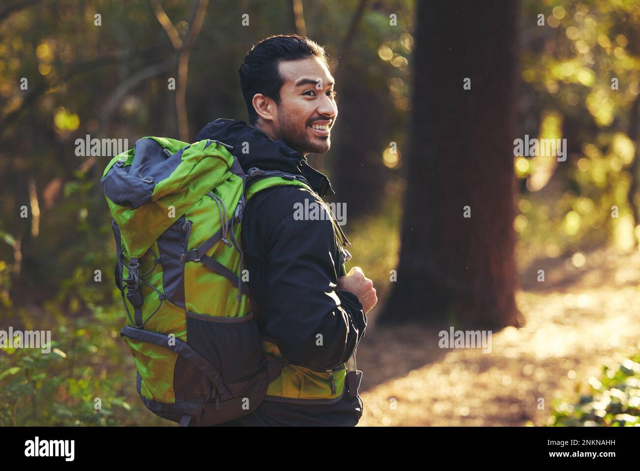Japanese man, backpacker and hiking in forest nature, trekking woods or ...