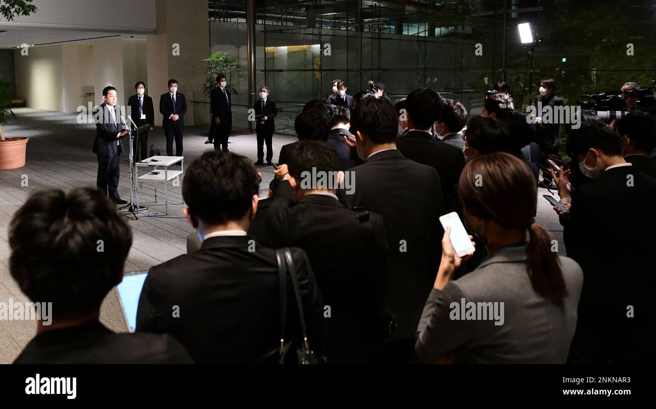 Japanese Prime Minister Fumio speaks to reporters after making a phone ...