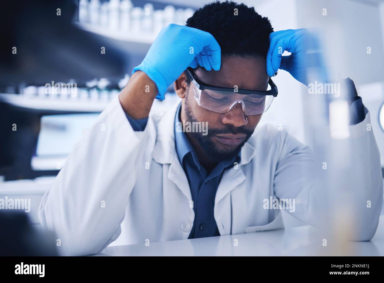 Tired, stress and scientist black man with a fail research in a lab or ...